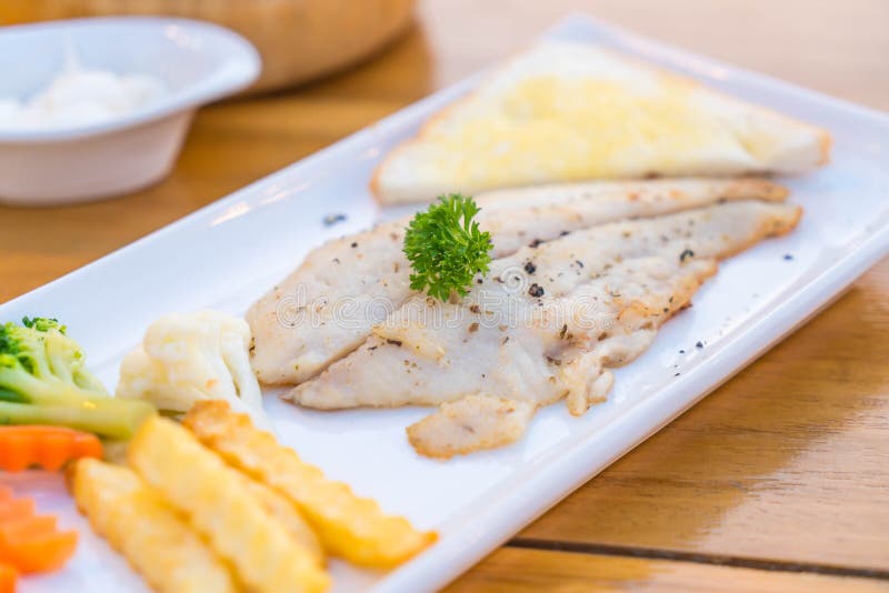 Fillet fish steak stock photo. Image of lettuce, dinner - 90849462