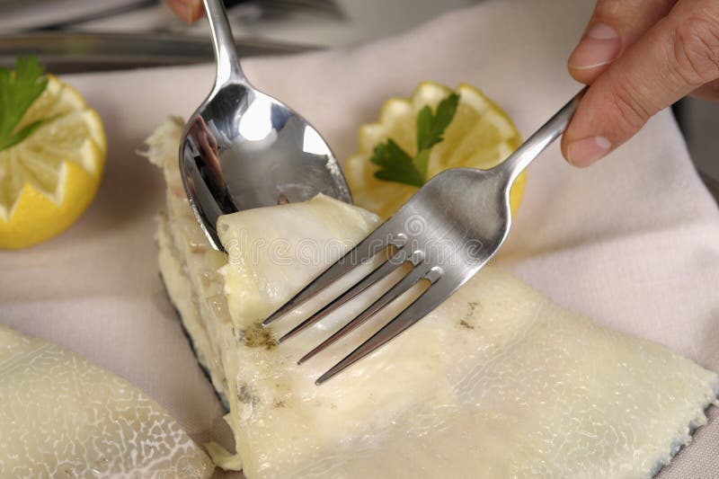 Filleting a poached turbot stock image. Image of ingredient - 23707481