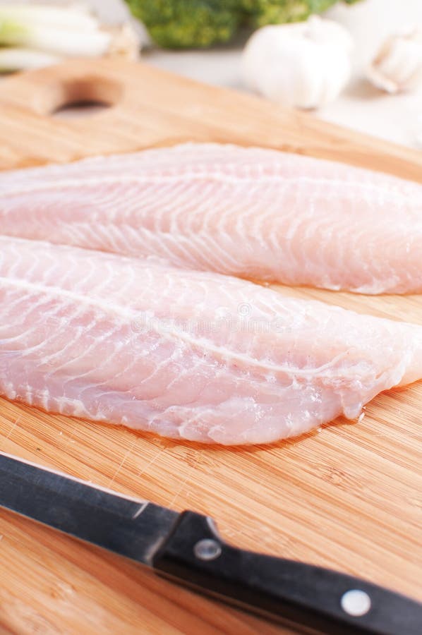 Two Raw White Fish Fillet and Knife Stock Photo - Image of hake ...