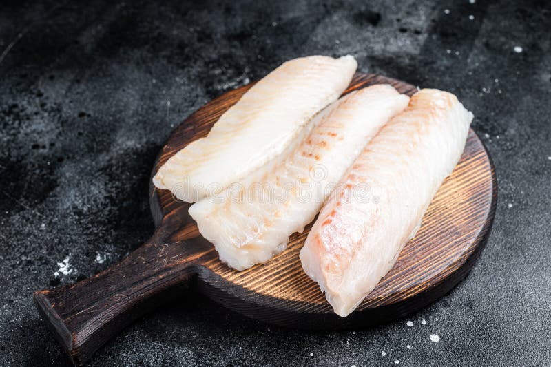 Fillets of Codfish, Raw Cod Fish Meat. Black Background Stock Photo ...