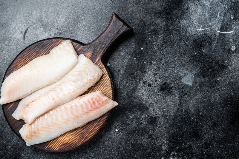 Fillets of Codfish, Raw Cod Fish Meat. Black Background. Top View Stock ...