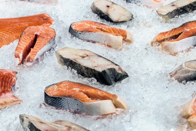 Fillets and Steaks of Fish Salmon and Cod Lie on the Ice Stock Photo ...