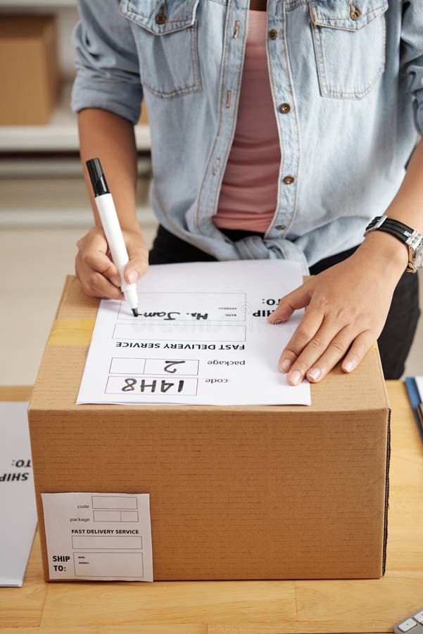 Filling Address and Name on Package Stock Photo - Image of hands ...