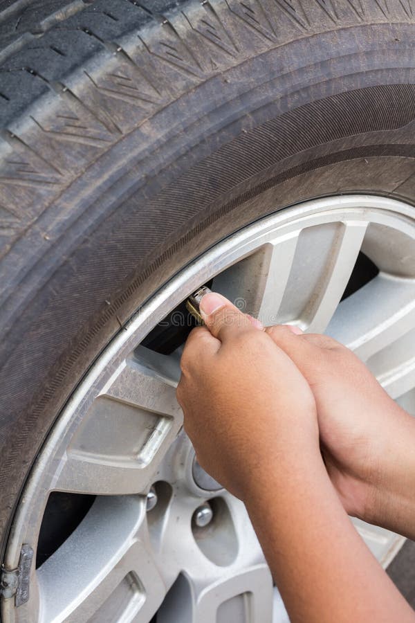 Filling Air into a Car Tire Stock Photo - Image of tire, tool: 54894722