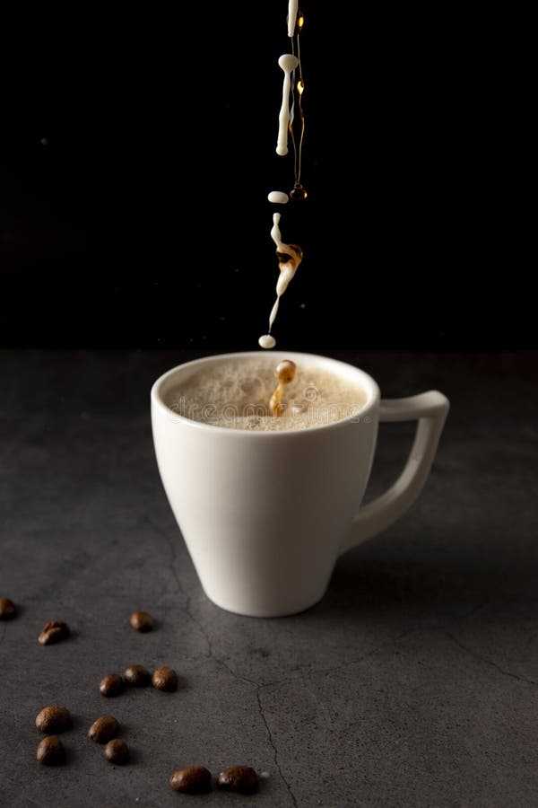 Filling a Coffee Cup with Coffee and Milk Stock Photo - Image of retro ...