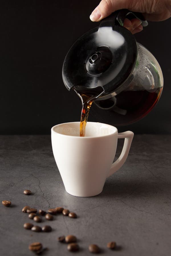 Filling a Coffee Cup with Coffee in Slow Motion Stock Photo - Image of ...