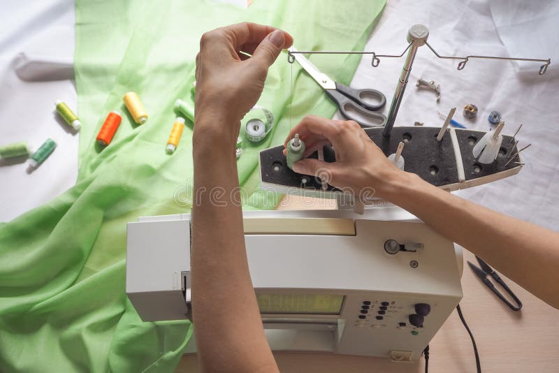 Filling the Coil Threads on the Sewing Machine. Stages of the ...