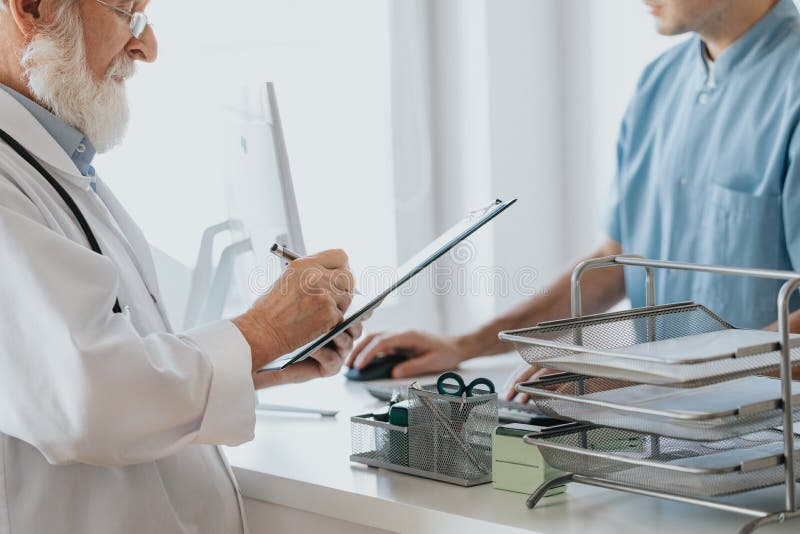 Filling the documents stock photo. Image of nurse, office - 193044990