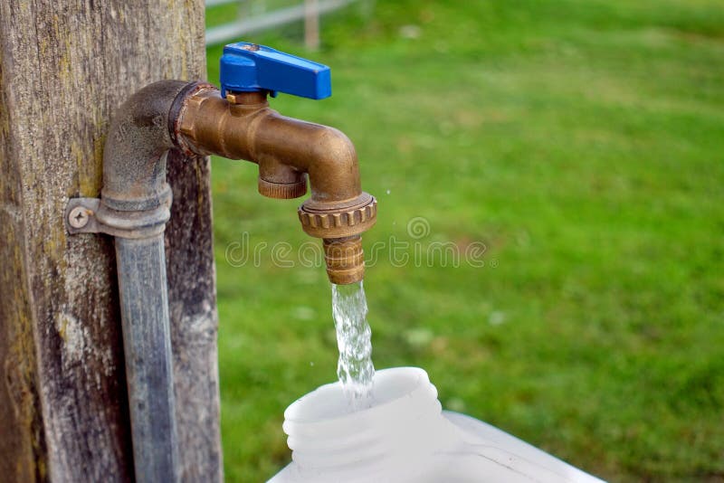 Filling a Drinking Water Container at a Campsite Water Supply Point ...