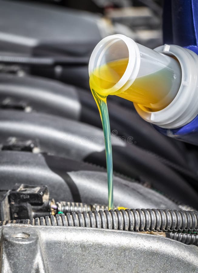 Pouring oil in the engine stock image. Image of motor - 145173035