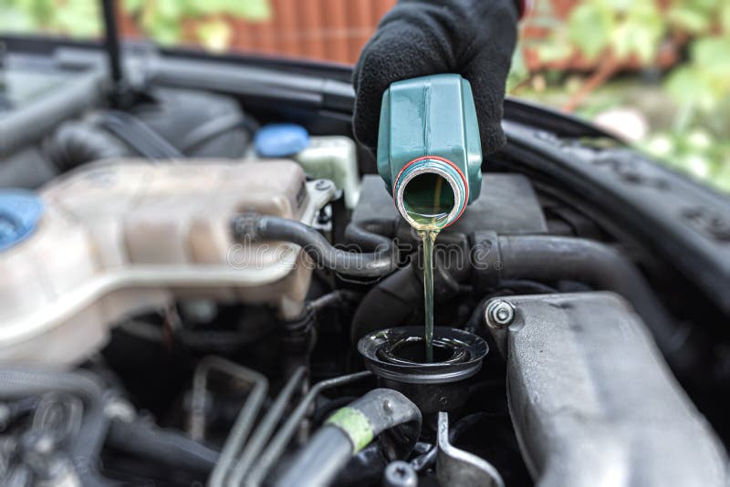 Filling engine oil. stock photo. Image of petrol, canister - 209501668