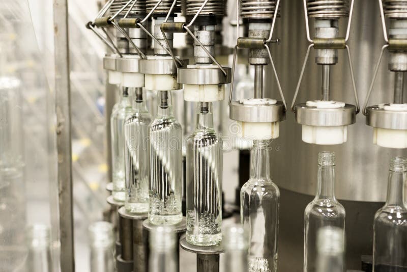 Filling Glass Bottles with Liquid. Stock Image - Image of industrial ...