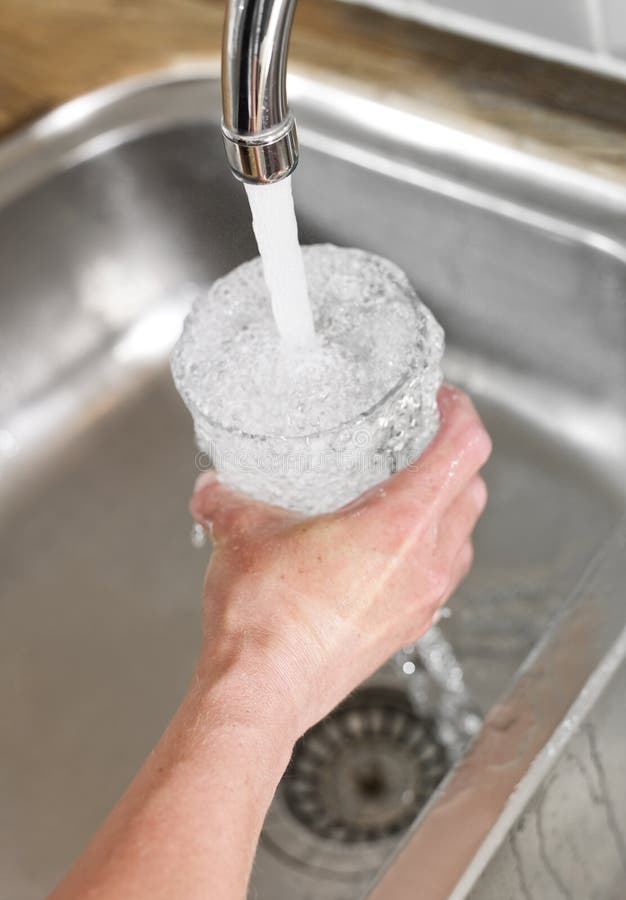 Filling a glass of water stock image. Image of refreshment - 14762895