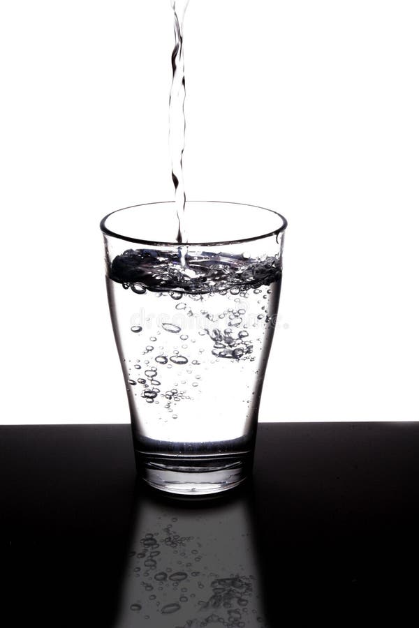 Filling a glass with water stock photo. Image of isolated - 18078628