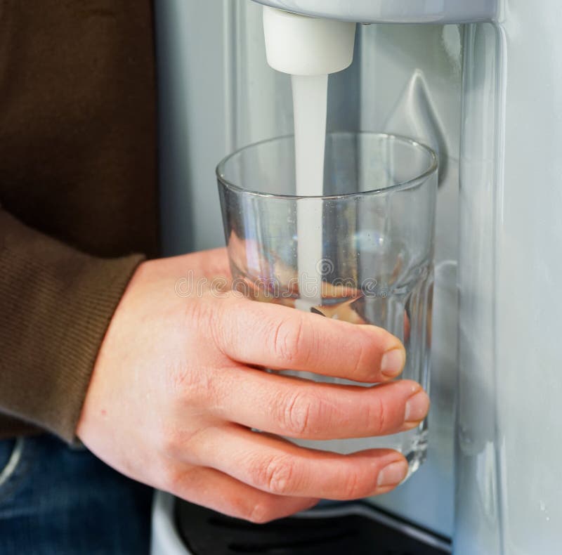 Filling Glass with Water from Dispenser Stock Photo - Image of holding ...