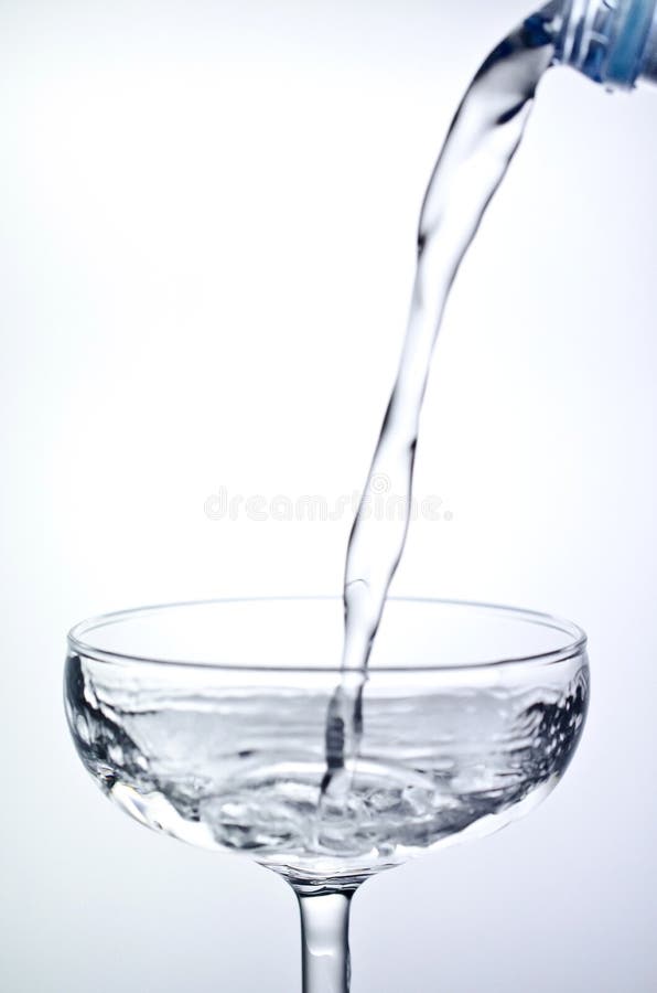 Filling a Glass with Water Showing a Drink Concept Stock Photo - Image ...