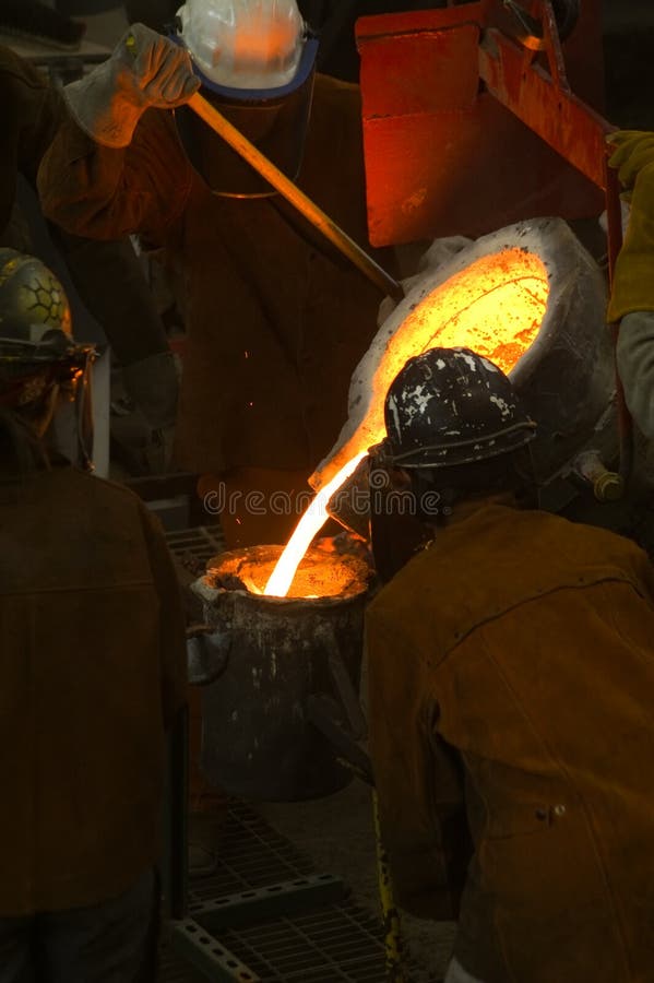 Filling the Ladle from the Crucible Stock Photo - Image of helmeted ...