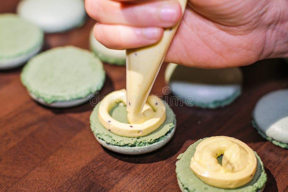 Filling Macarons with Cream Stock Photo - Image of sugar, meringue ...