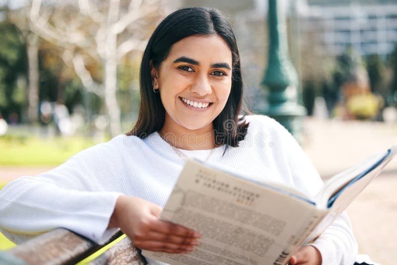 Filling My Head with Some Knowledge. a Young Female Student Reading a ...