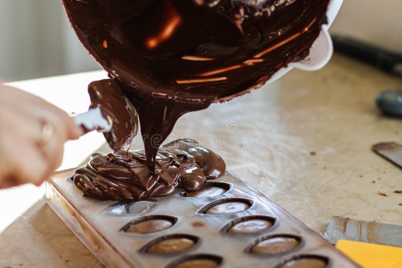 Filling out candy mold stock photo. Image of sweets, multiple - 84187822