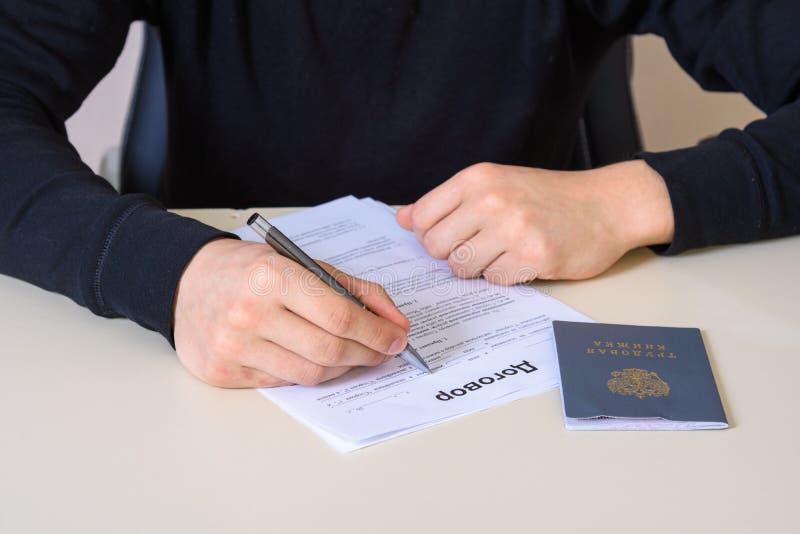 Filling Out an Employment Contract and Employment Record Book Stock ...