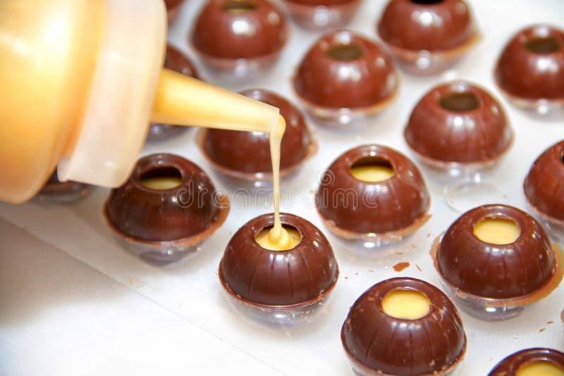 Filling pralines stock image. Image of gourmet, manufacturing - 75633373