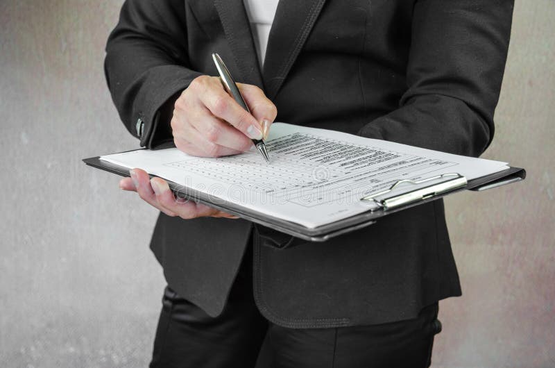 Filling in questionnaire stock photo. Image of concept - 56909400