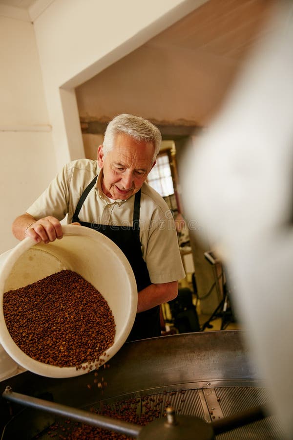 Filling the Roaster. Cropped Shot of a Senior Man Working in a Roastery ...