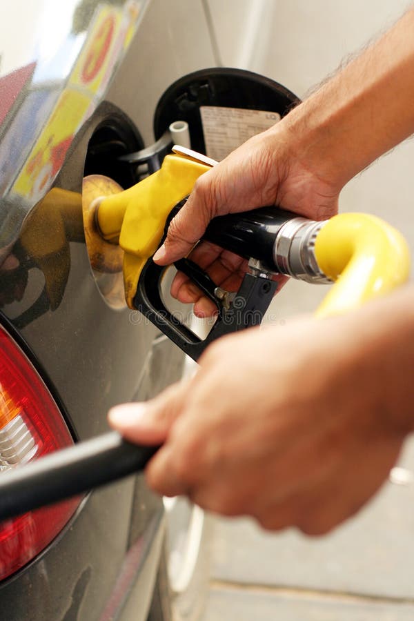 Filling gas tank stock photo. Image of dollars, mileage - 23519490