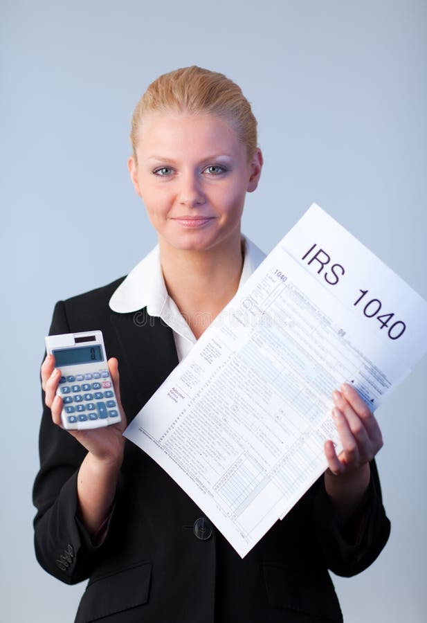 Filling in tax returns stock image. Image of accounting - 10597573
