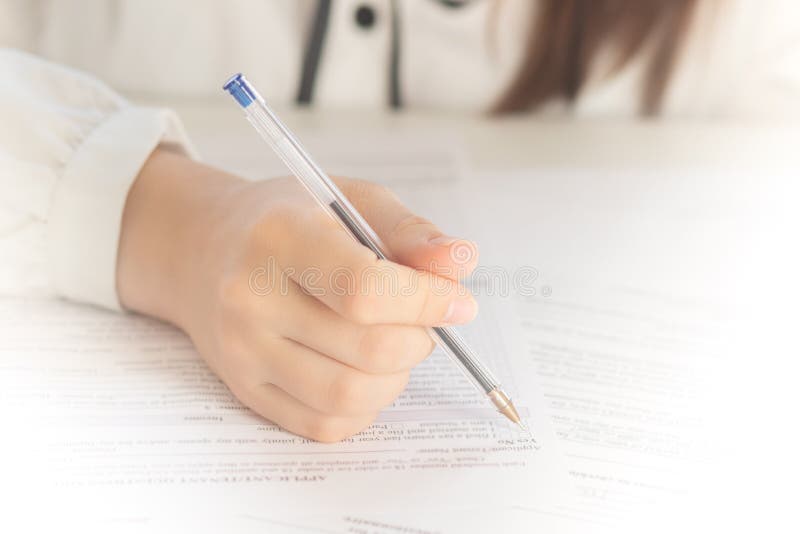 Filling the Test. Hands Hold a Pen Over Paper Stock Photo - Image of ...