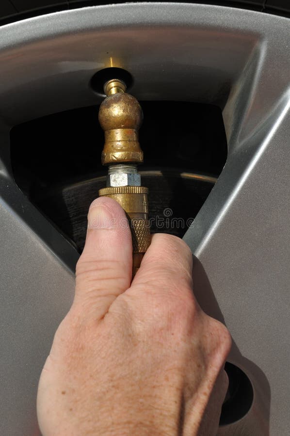 Filling a Tire with Air stock image. Image of tyre, pump - 16431259