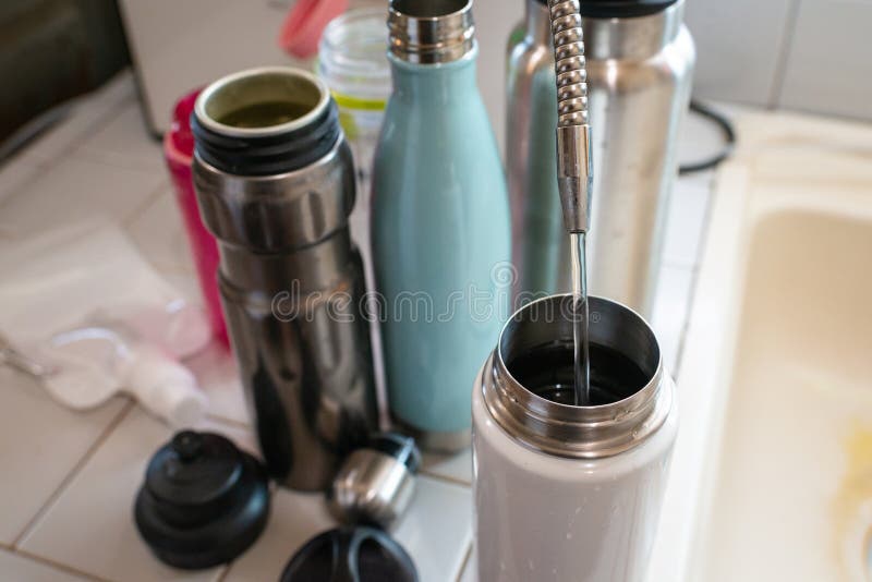 Filling Up Reuseable Water Bottles for the Family Stock Image - Image ...