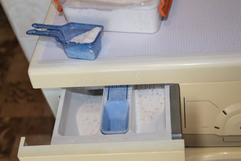Filling the Washing Machine with Washing Powder. Stock Photo - Image of ...