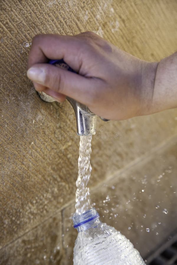 Filling water bottle stock photo. Image of healthy, full - 248848306