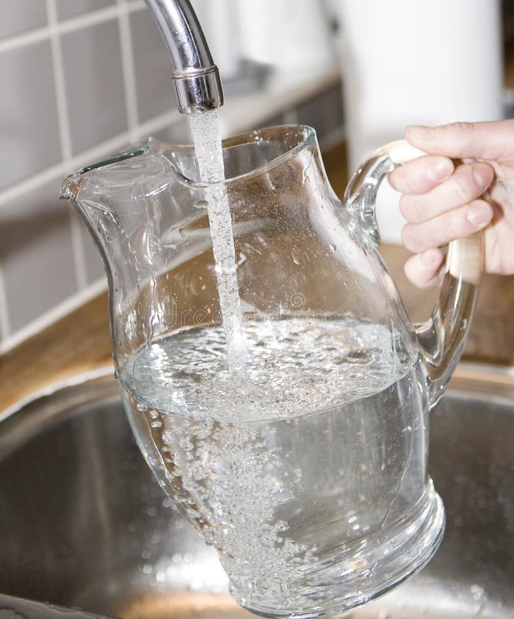 Filling a glass of water stock image. Image of drink - 14762927