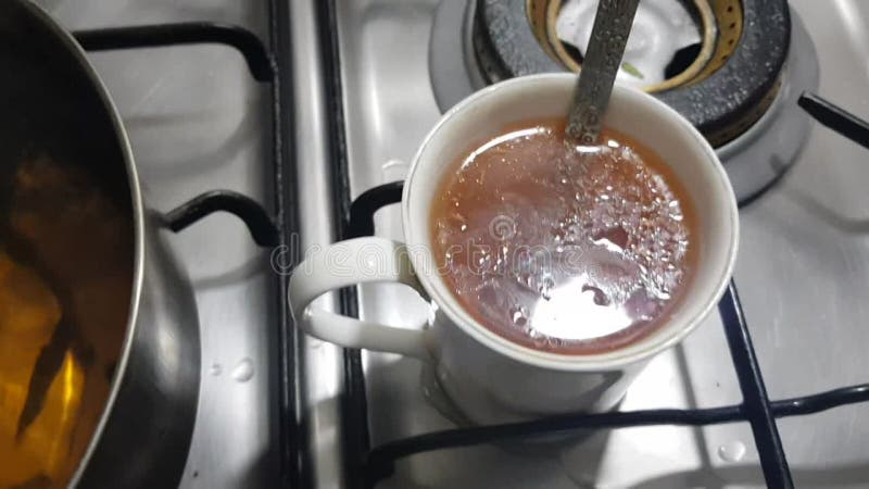 Filling White Cup of Tea with and Mixing Honey and Tea Stock Video ...