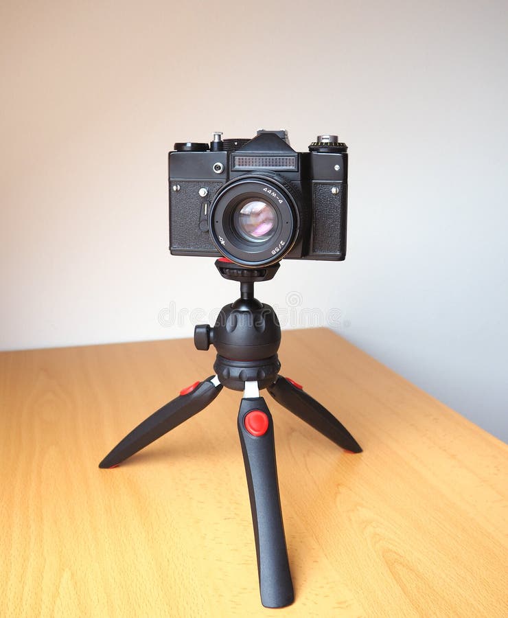 Vintage camera on a tripod stock image. Image of throught - 172681219