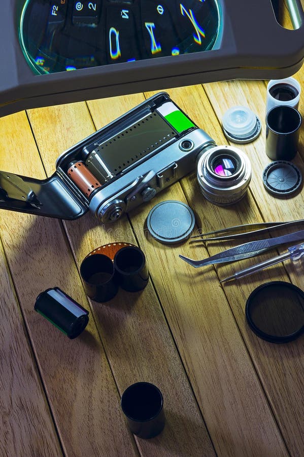 Film Camera on a Table Under a Magnifying Glass Stock Image - Image of ...