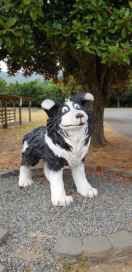 A Statue of a Tree and a Dog in the Park Stock Photo - Image of gravel ...