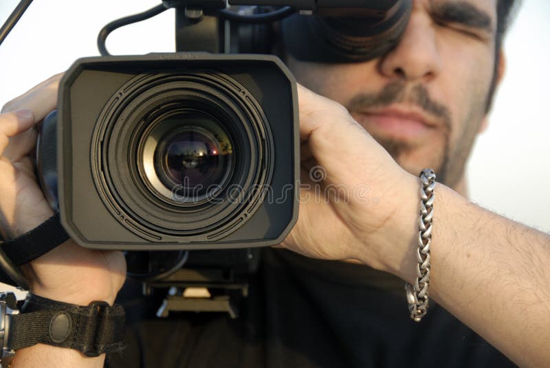 Cameraman filming editorial stock photo. Image of microphone - 15911778