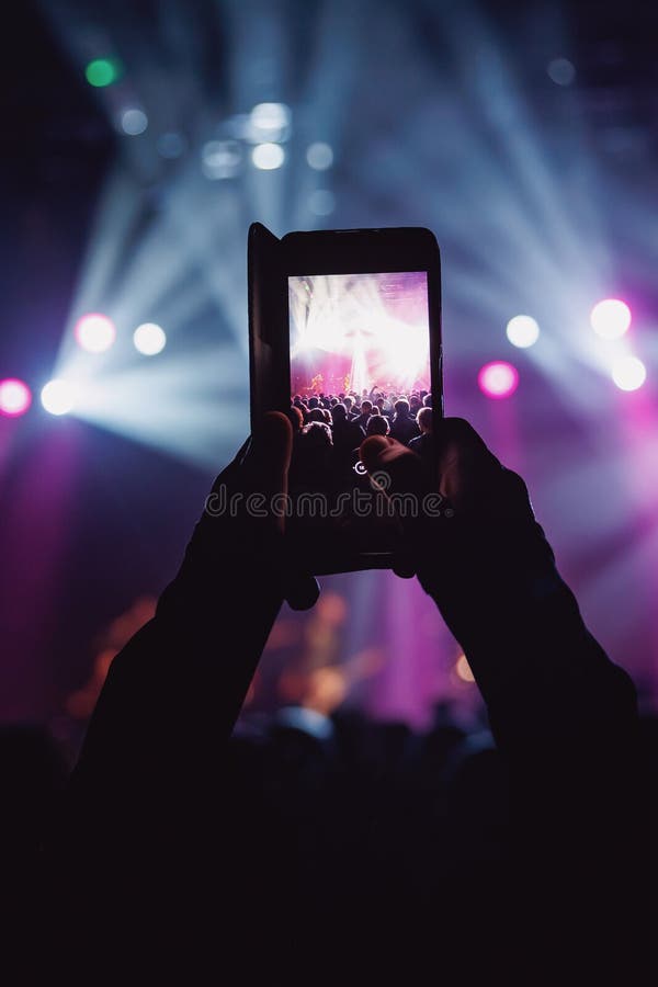 Filming a Concert with a Mobile Phone, Music and Light Show on Stage ...