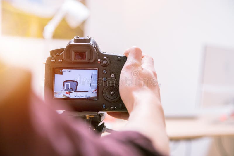 Filming with a Digital Camera: Man is Using a Camera Standing on a ...