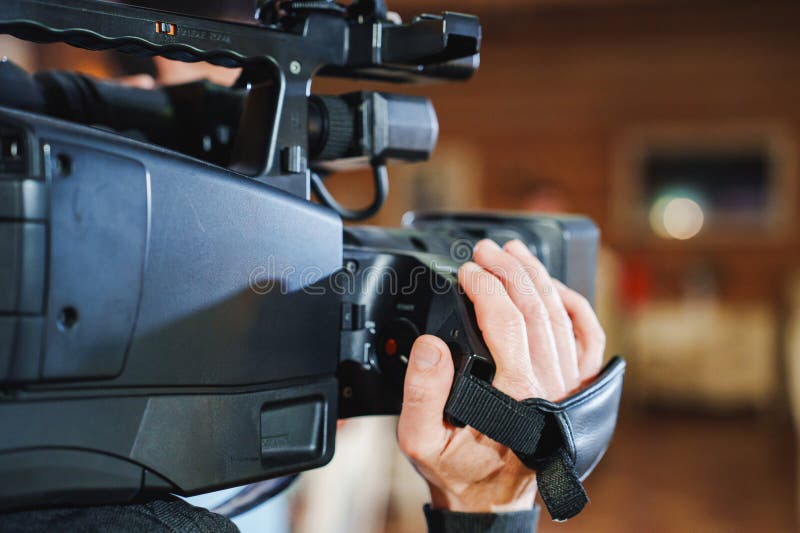 Filmmaker Capturing Important Moments with Professional Camera in ...