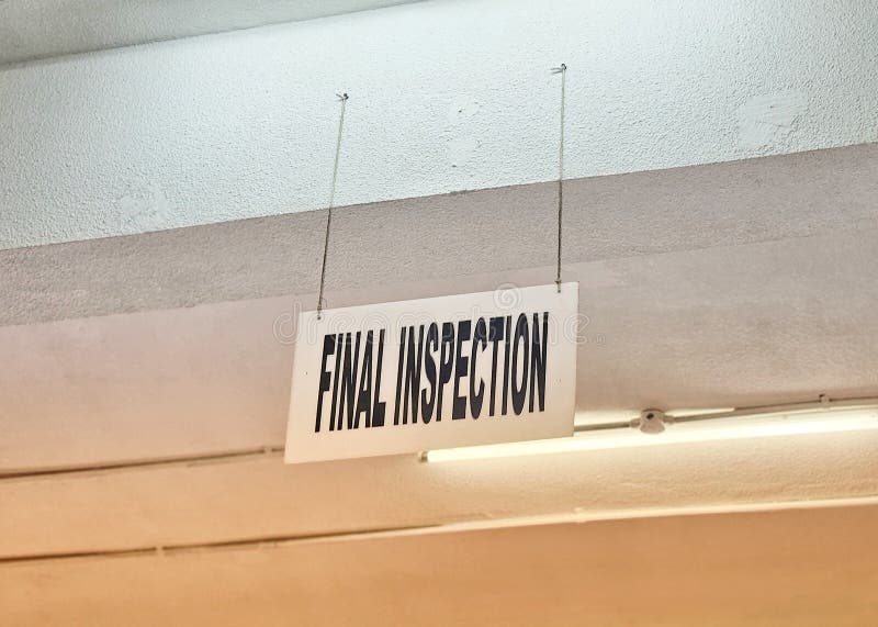 Final Inspection Hanging Sign from Low Angle Stock Photo - Image of ...