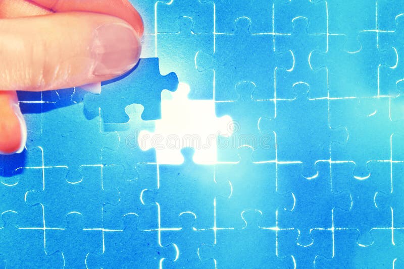 Final Jigsaw Puzzle Piece Put into Place by Hand. Stock Photo - Image ...