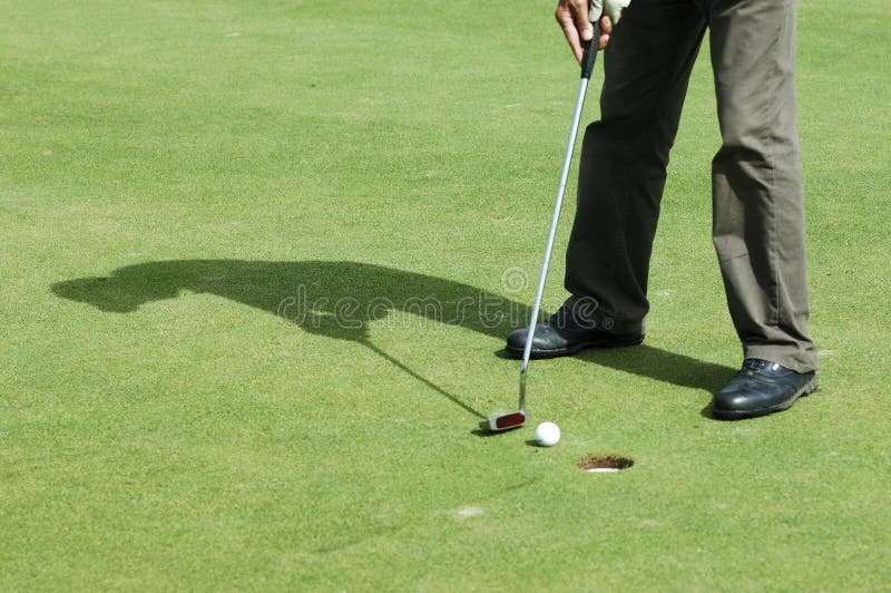 Final putt on golf course stock image. Image of putting - 7097671