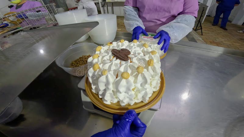 The Final Step in Making the Cake. Completion of the Cake at the ...