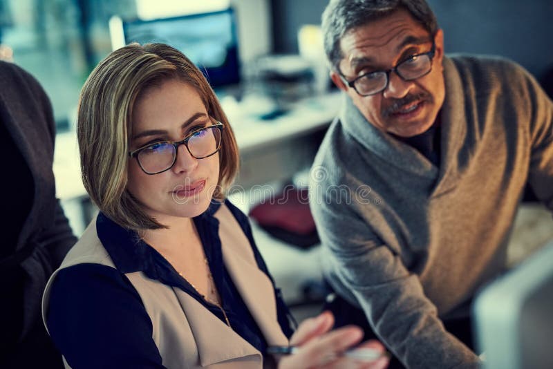Finalizing Their Plans for Success. Two Businesspeople Working Late in ...