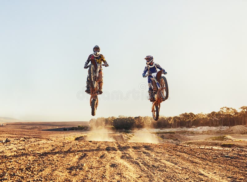 Finally...a Challenge. a Shot of Two Motocross Riders Racing Side by ...